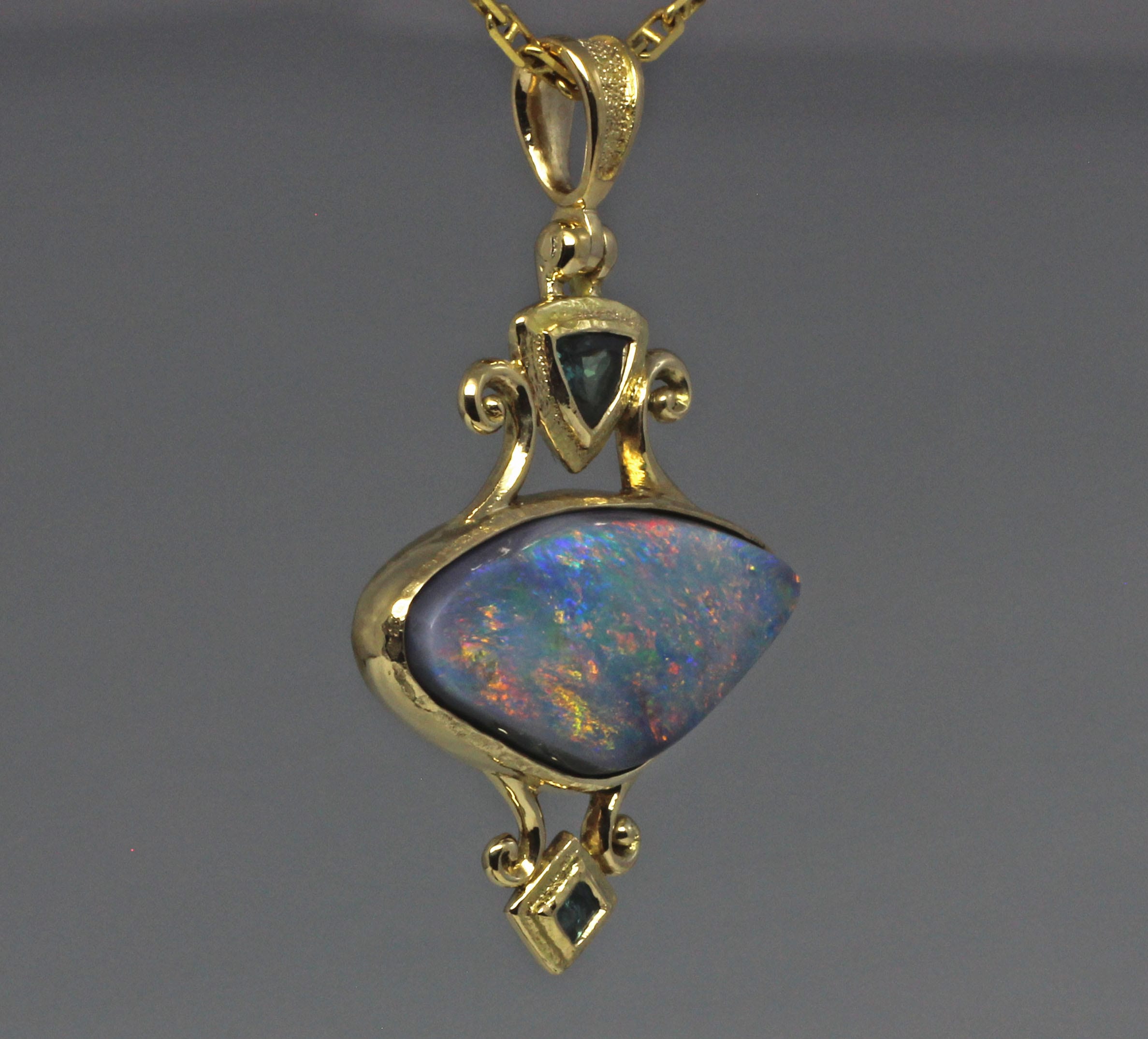 Black opal and Russian alexandrite pendant, in 18k