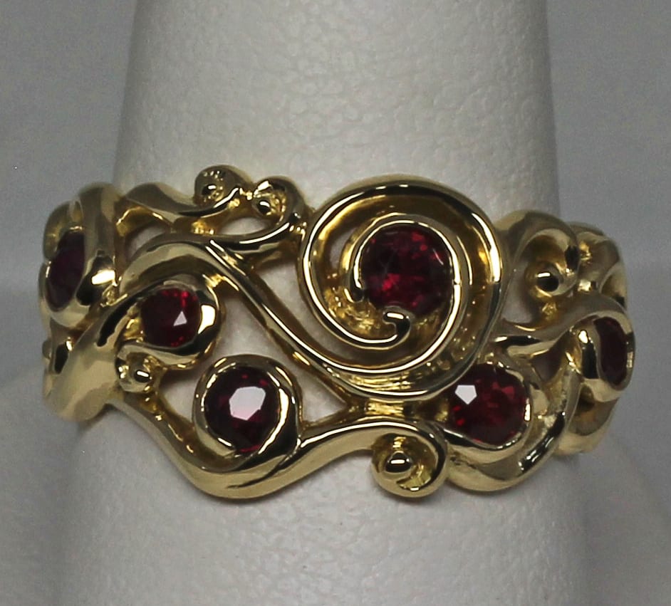 Ruby swirl ring, It's design inspired by Arthurian legends.