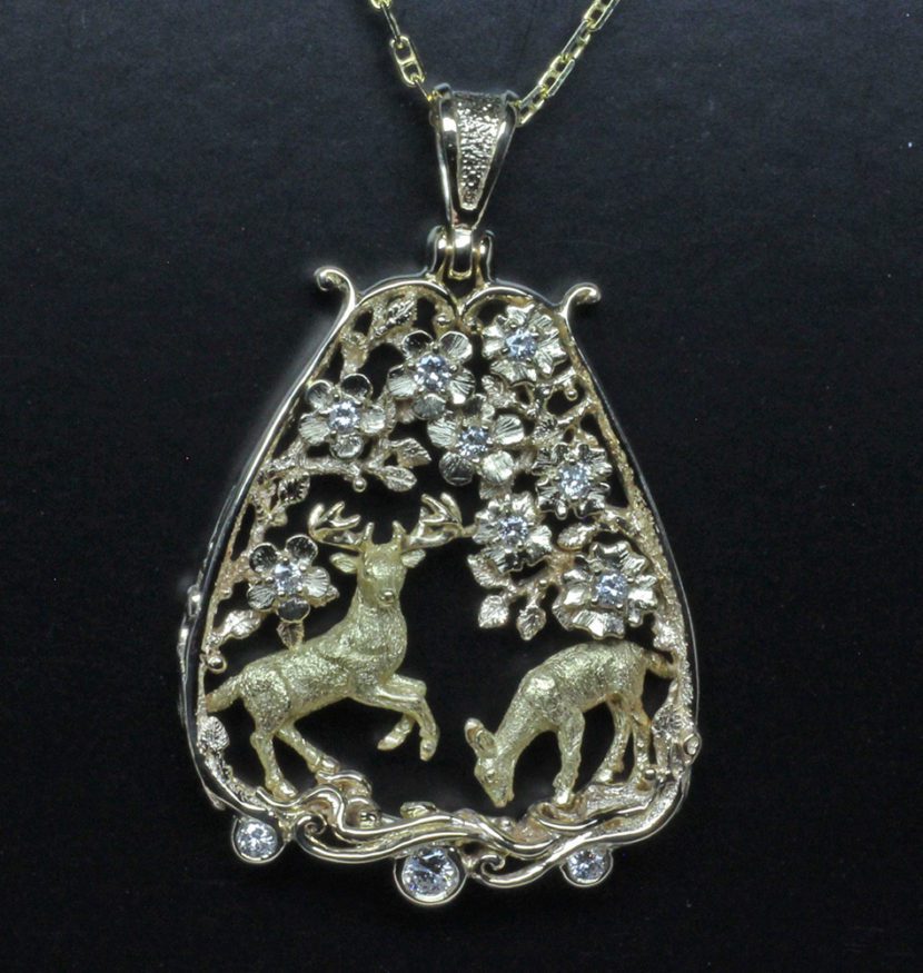 Highland deer gold pendant, an 18K stag and doe among diamond flowers