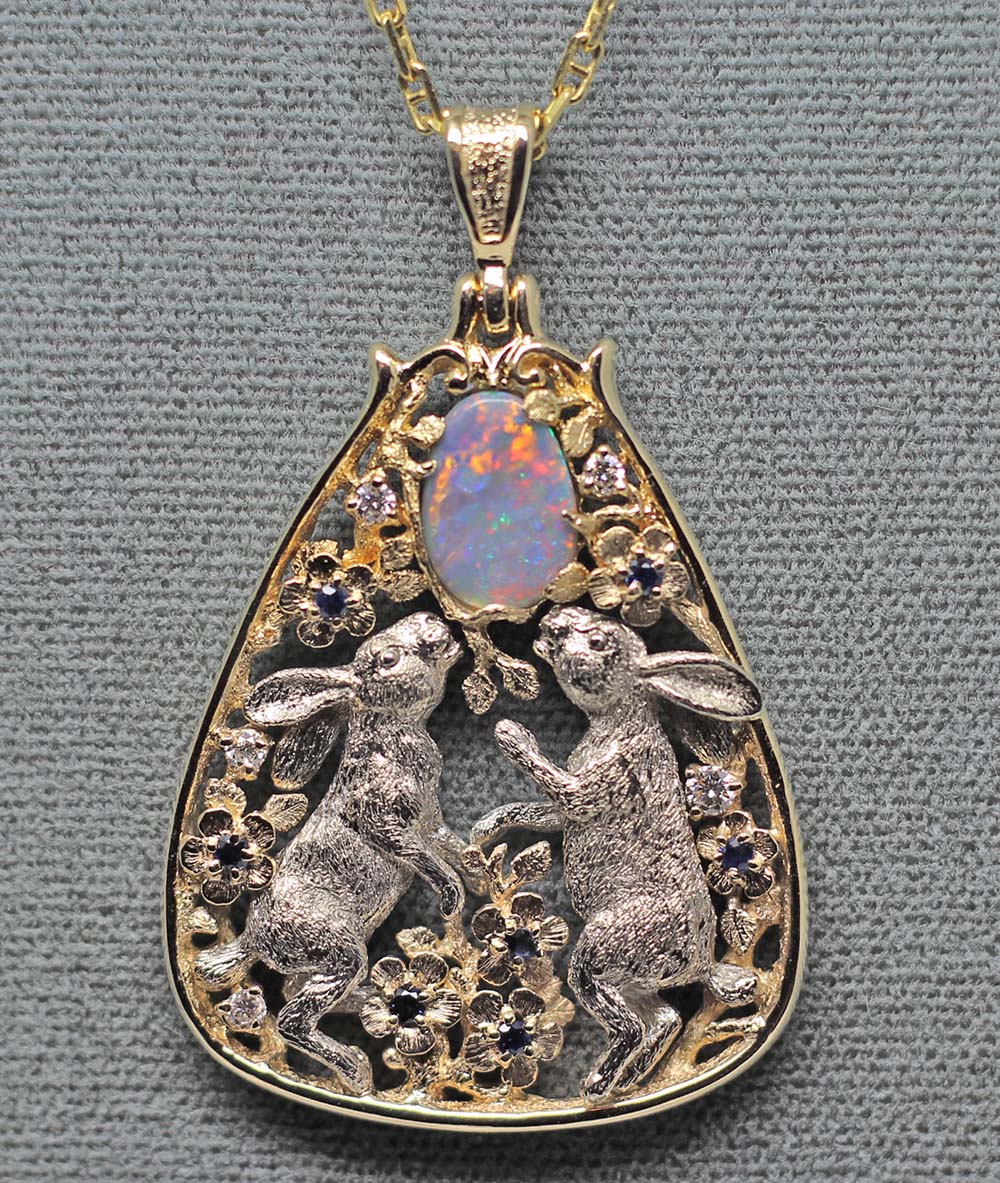 Dancing White Rabbits Pendant, Black opal, & precious stones
