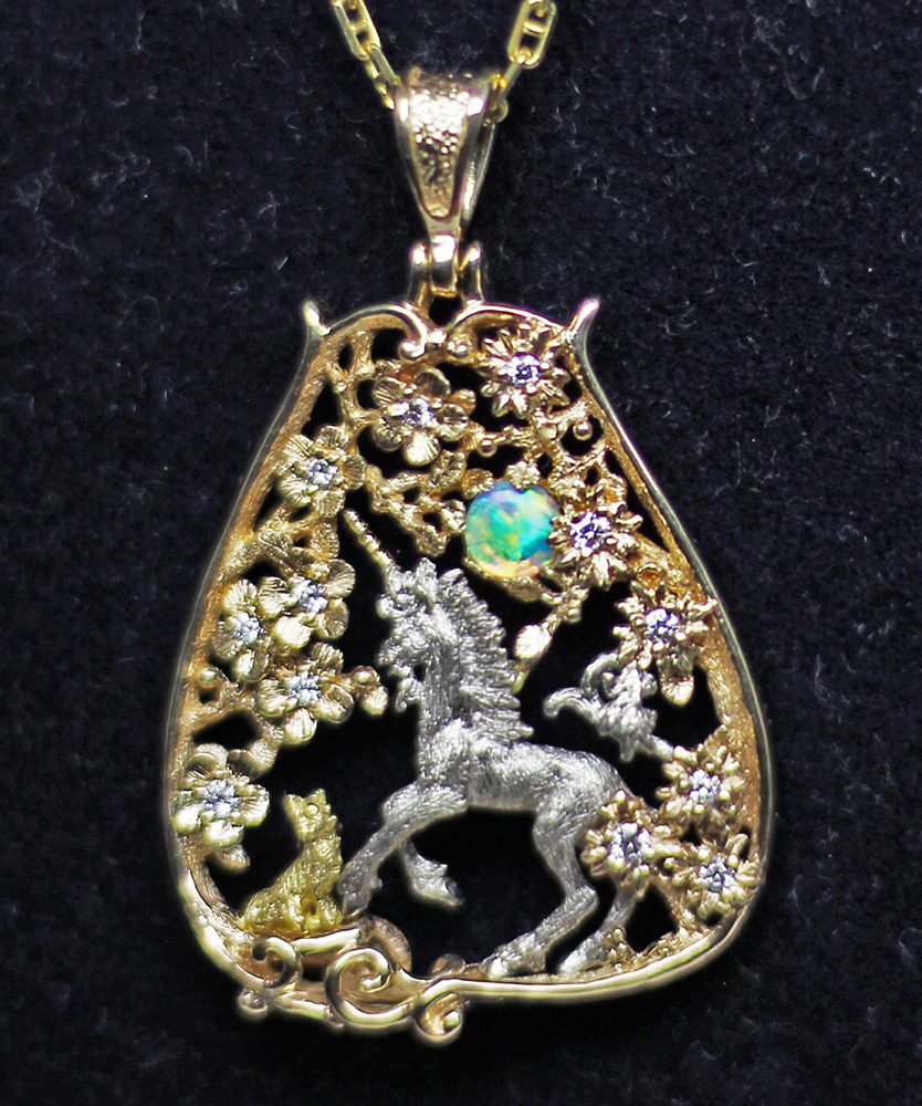Unicorn and fox pendant, yellow and white gold, diamonds.