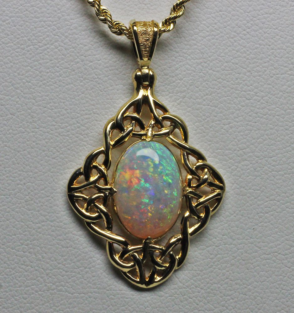 Celtic knot opal pendant, in 14k set with a "pinfire" opal